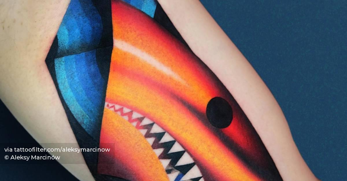 Shark tattoo located on the inner arm.