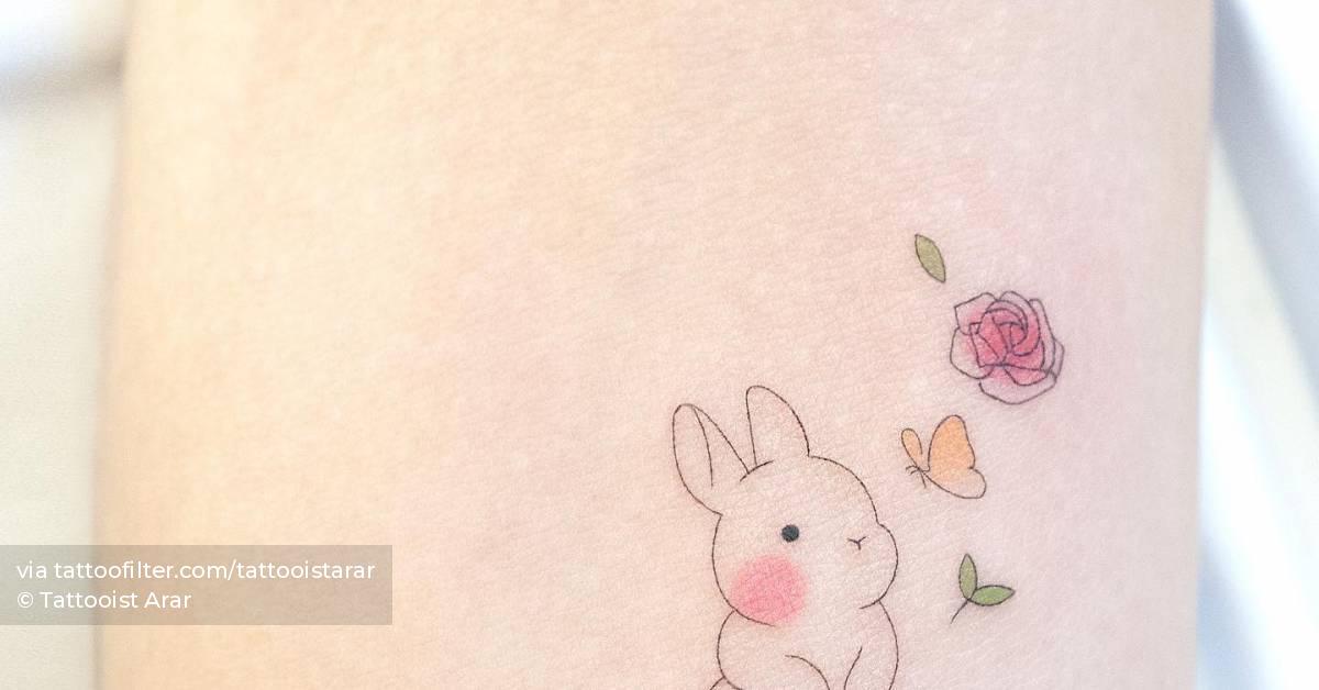 Cute rabbit tattoo located on the inner forearm.