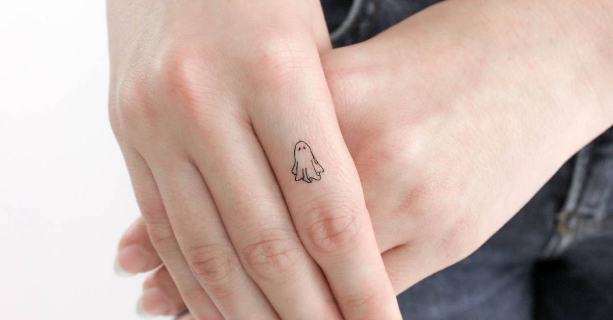 Tiny minimalistic ghost temporary tattoo located on the