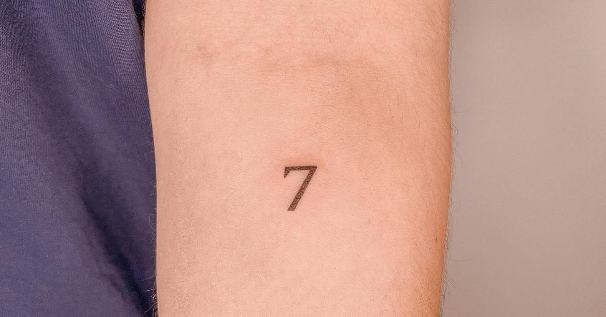 Tattoo of the number "7" located on the inner forearm.