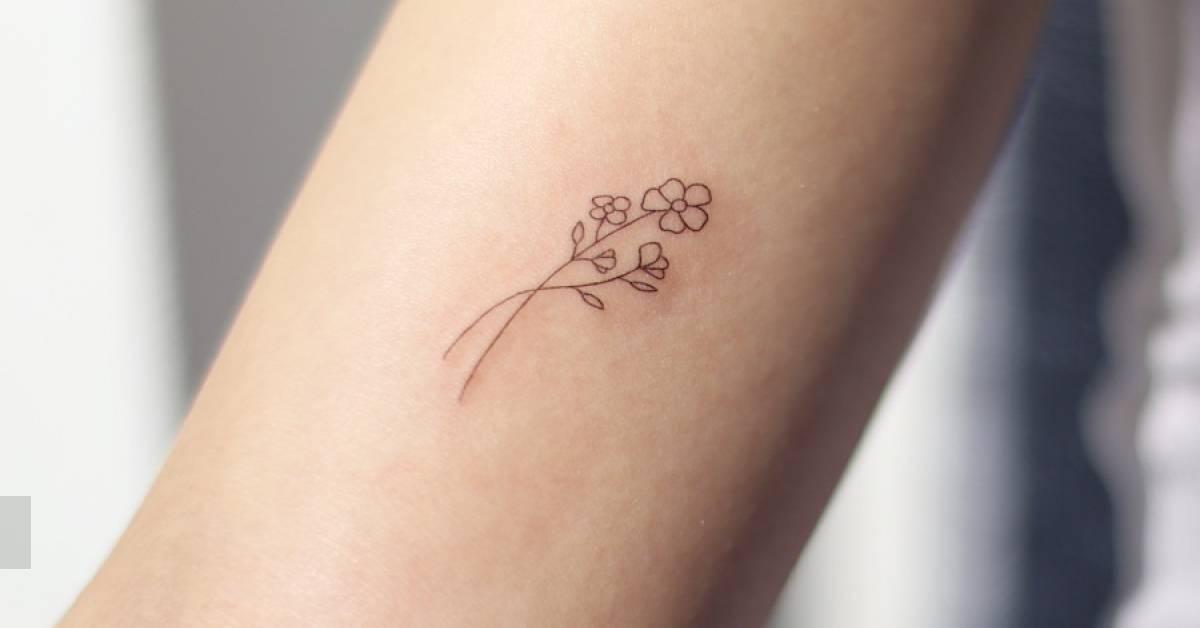 Minimalistic flowers tattoo done on the inner arm, fine