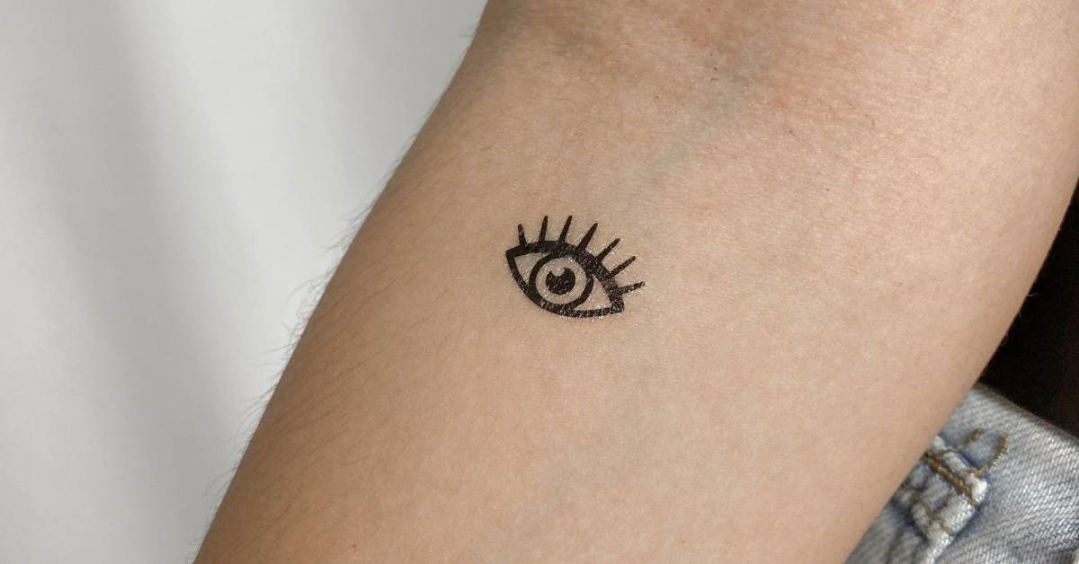 Minimalistic style evil eye temporary tattoo done on