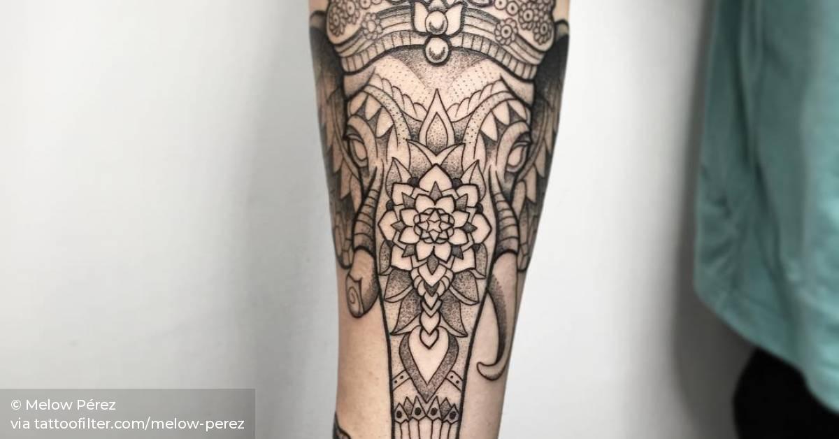 Ornamental style elephant head tattoo on the right