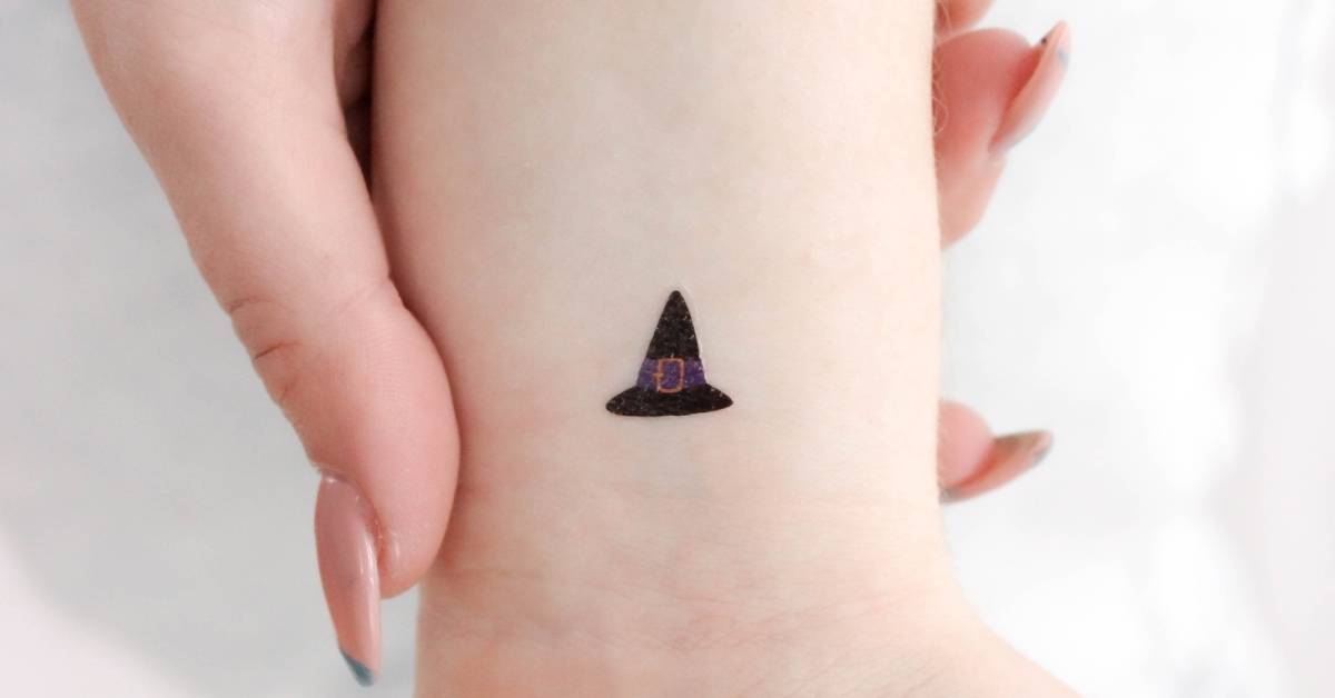 Witch hat temporary tattoo located on the wrist.