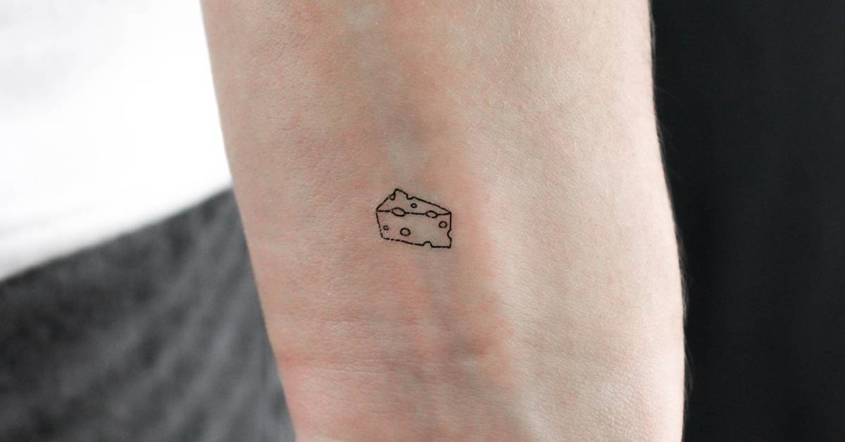 Tiny minimalistic cheese temporary tattoo located on