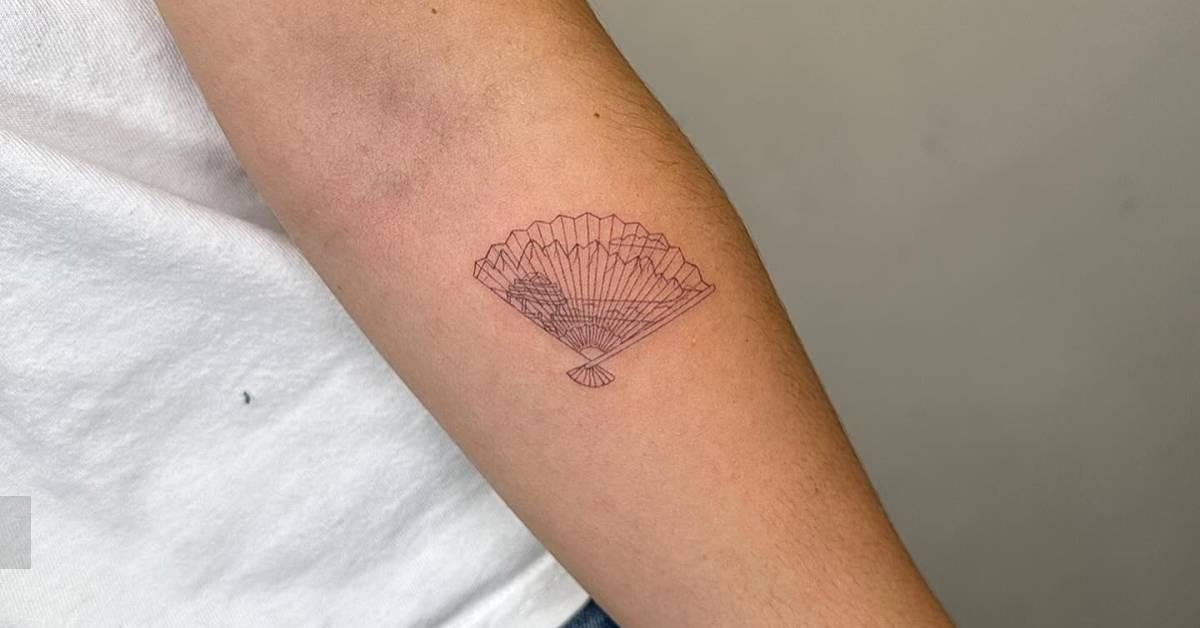 Fine line style hand fan tattoo placed on the inner