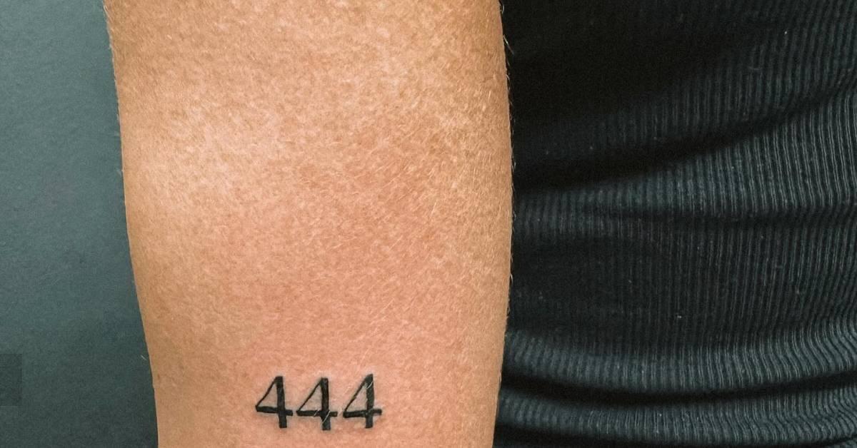 Angel number "444" tattoo located on the tricep.
