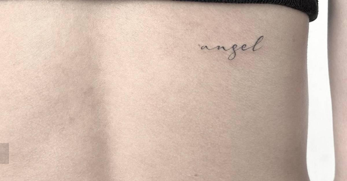 Tattoo of the word "angel" located on the back.