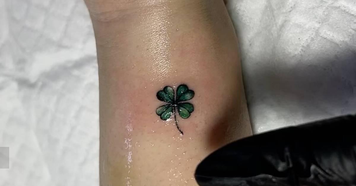 Illustrative style four leaf clover tattoo done on the