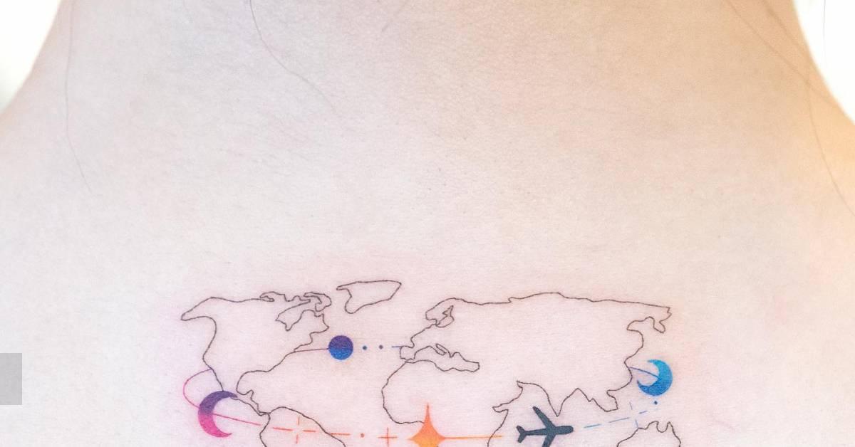 Around the world tattoo located on the upper back.