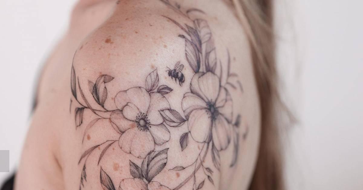 Illustrative style anemones tattoo located on the