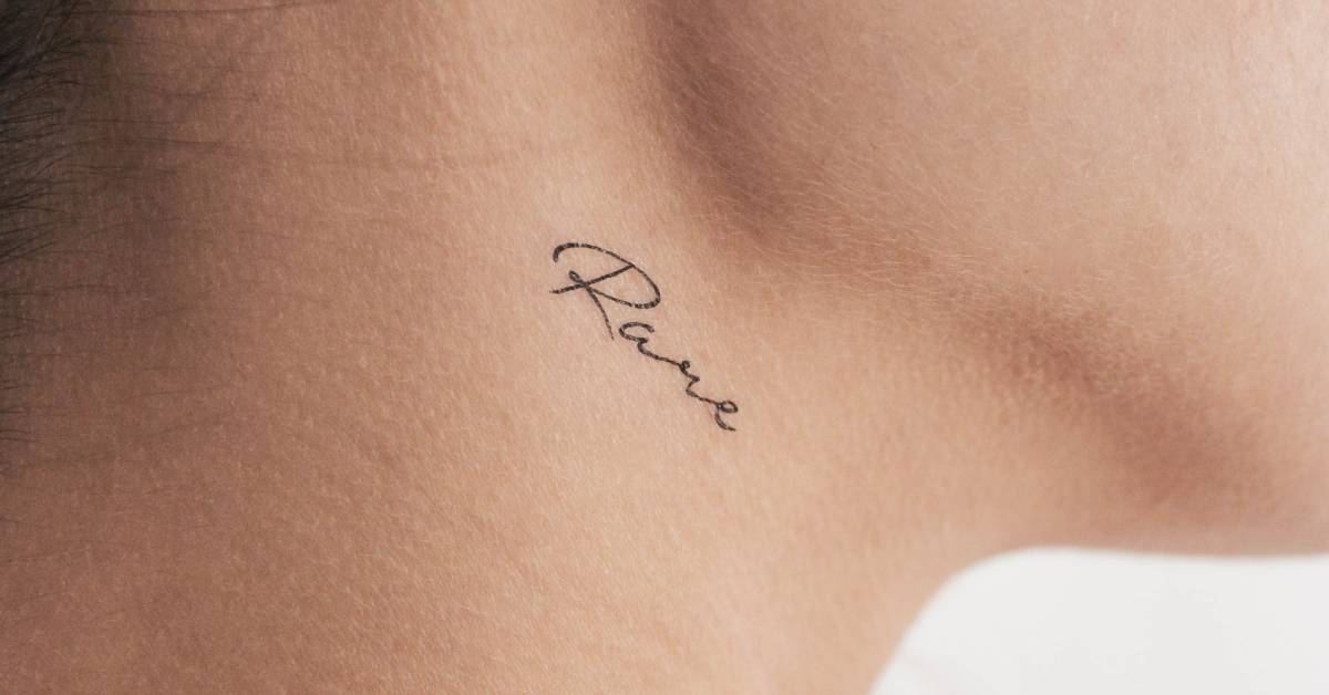 Temporary lettering tattoo of the word "rare" located