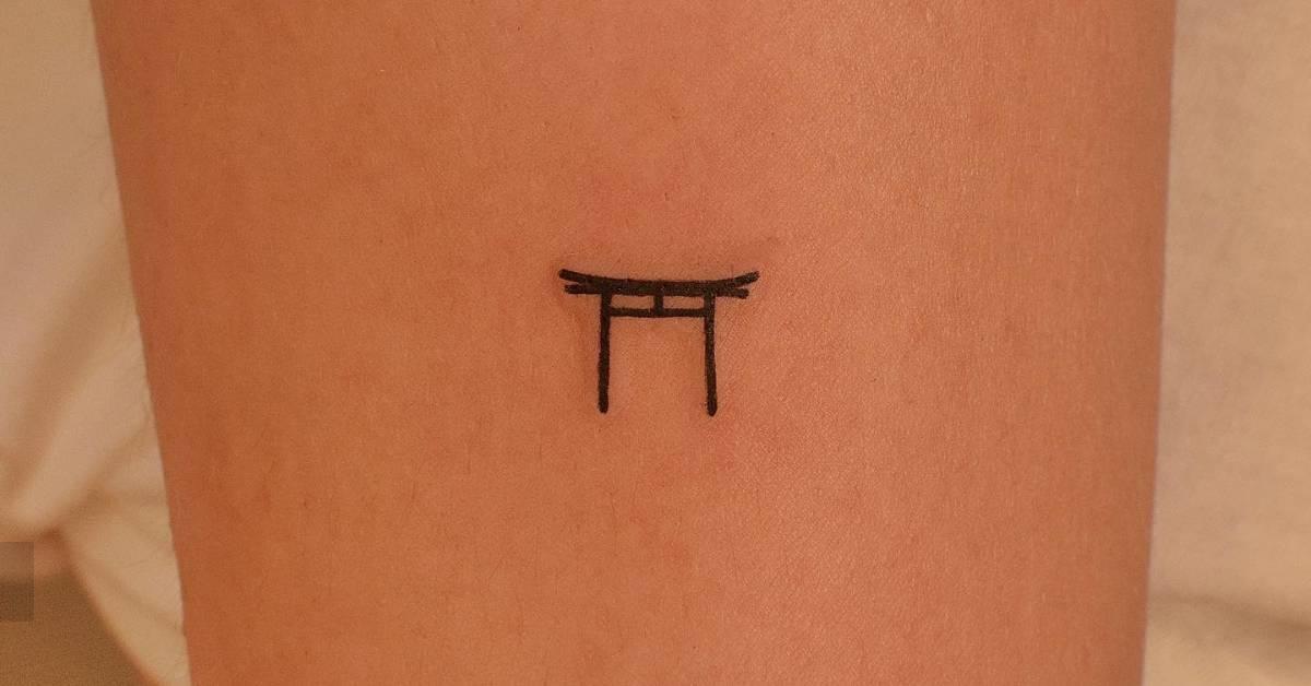 Minimalistic style Shinto shrine tattoo located on the