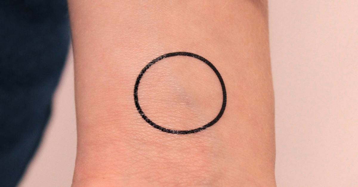 Minimalistic style circle temporary tattoo done on the
