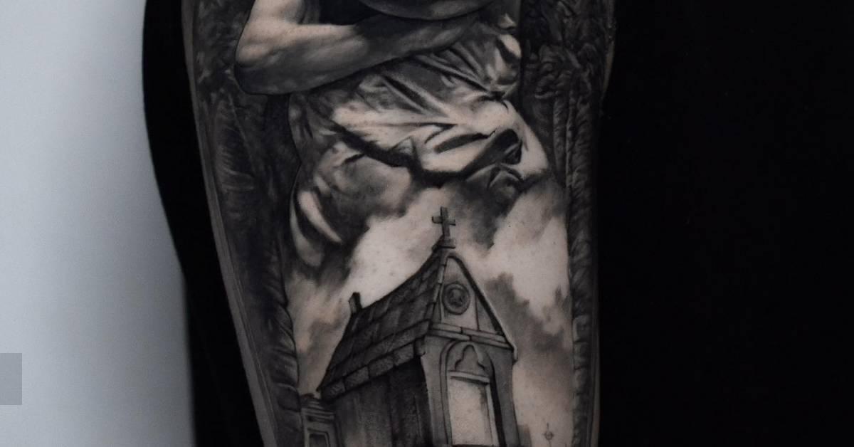 Black and grey Lucifer tattoo located on the upper arm.