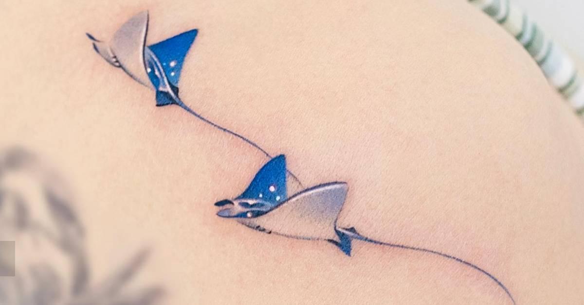 Watercolor style stingray tattoo located on the