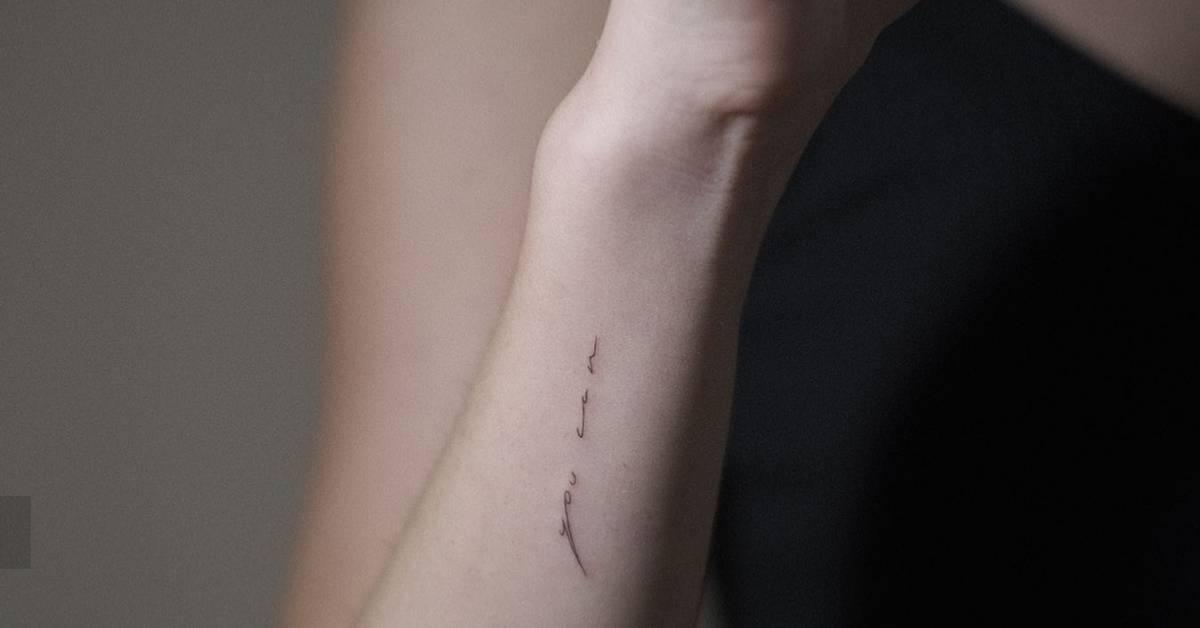 "You can" lettering tattoo handwritten on the wrist.