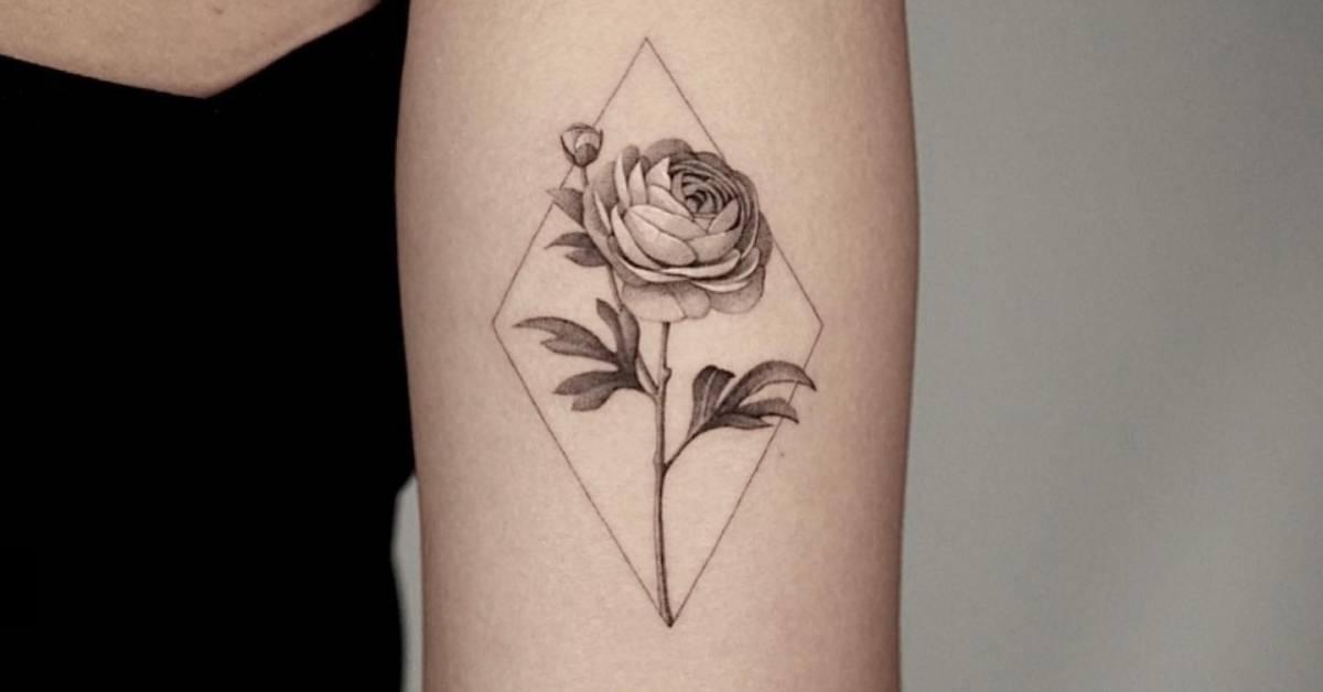 Micro-realistic style ranunculus flower tattoo located