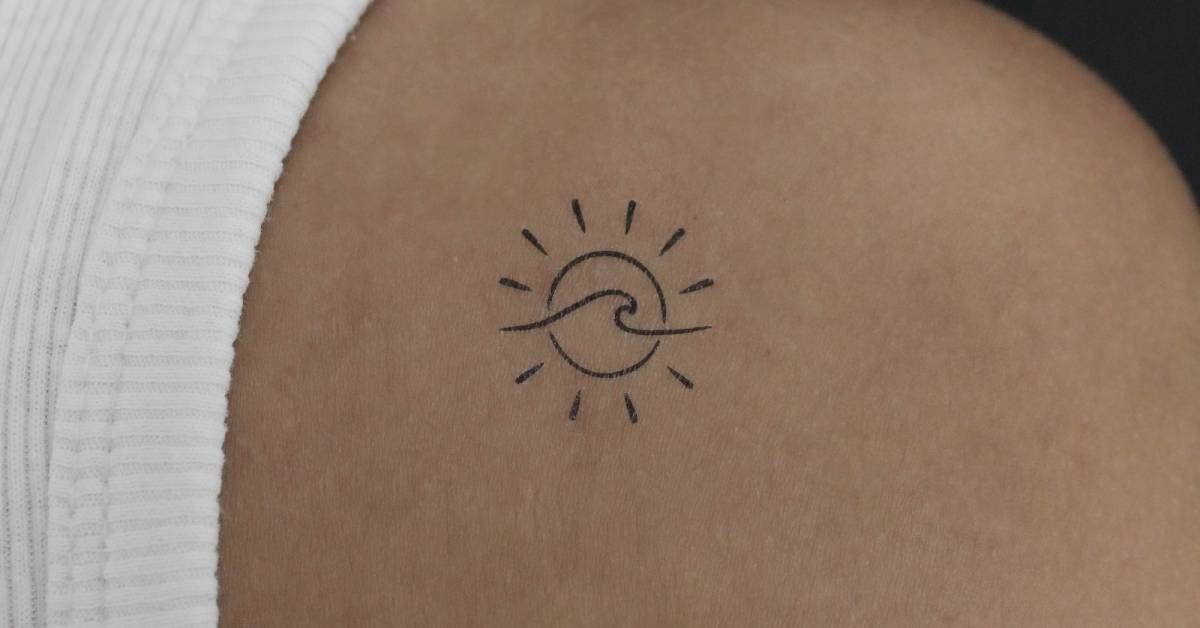 Minimalistic style sun and Wave temporary tattoo done