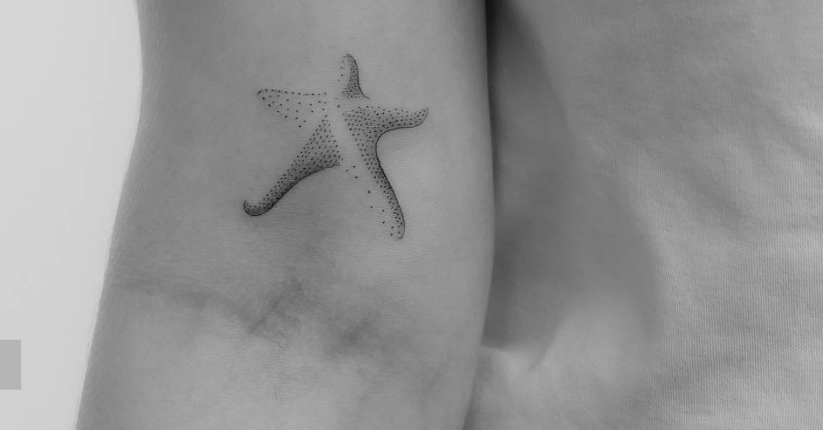 Dotwork style starfish tattoo done on the bicep.