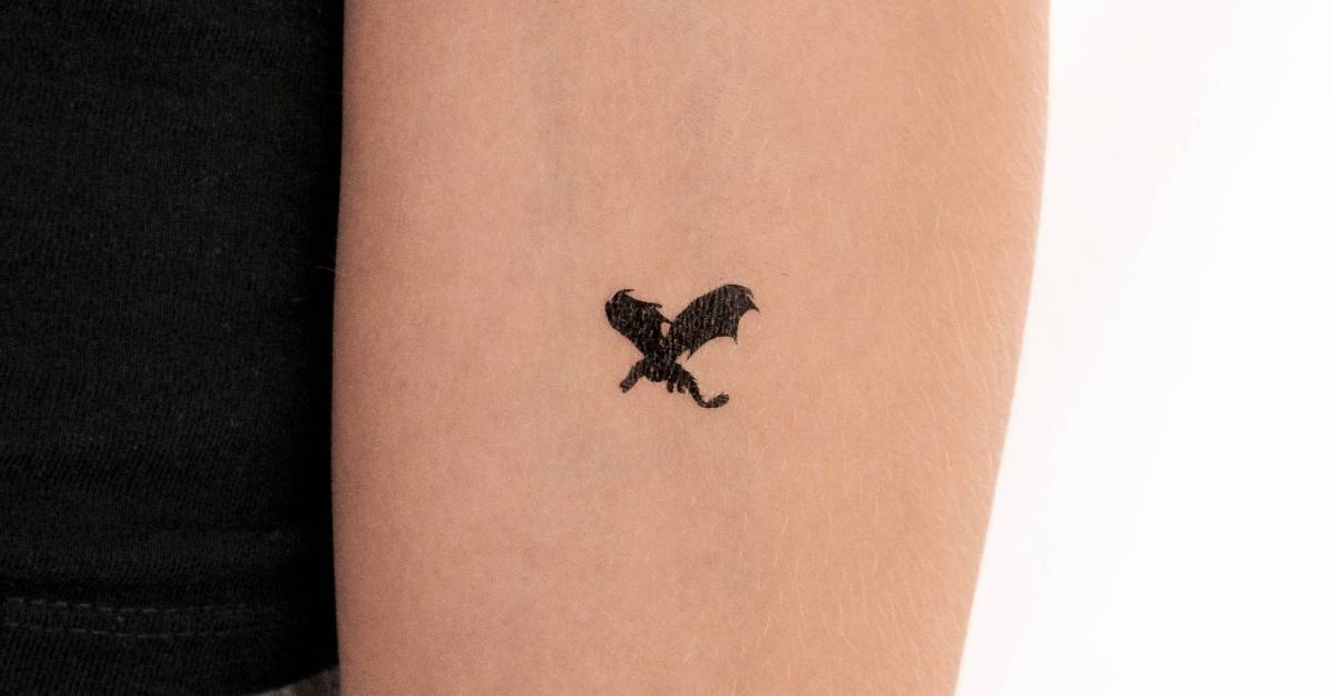 Flying dragon temporary tattoo located on the inner
