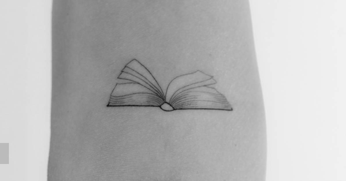 Fine line style book tattoo placed on the inner