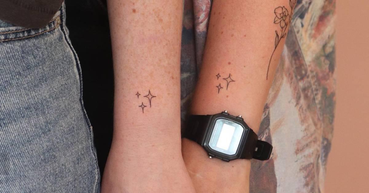 Matching minimalistic stars tattoo for couple.