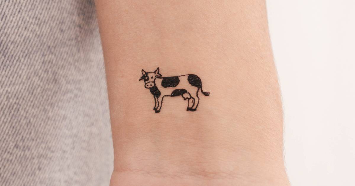 Cow temporary tattoo located on the wrist.