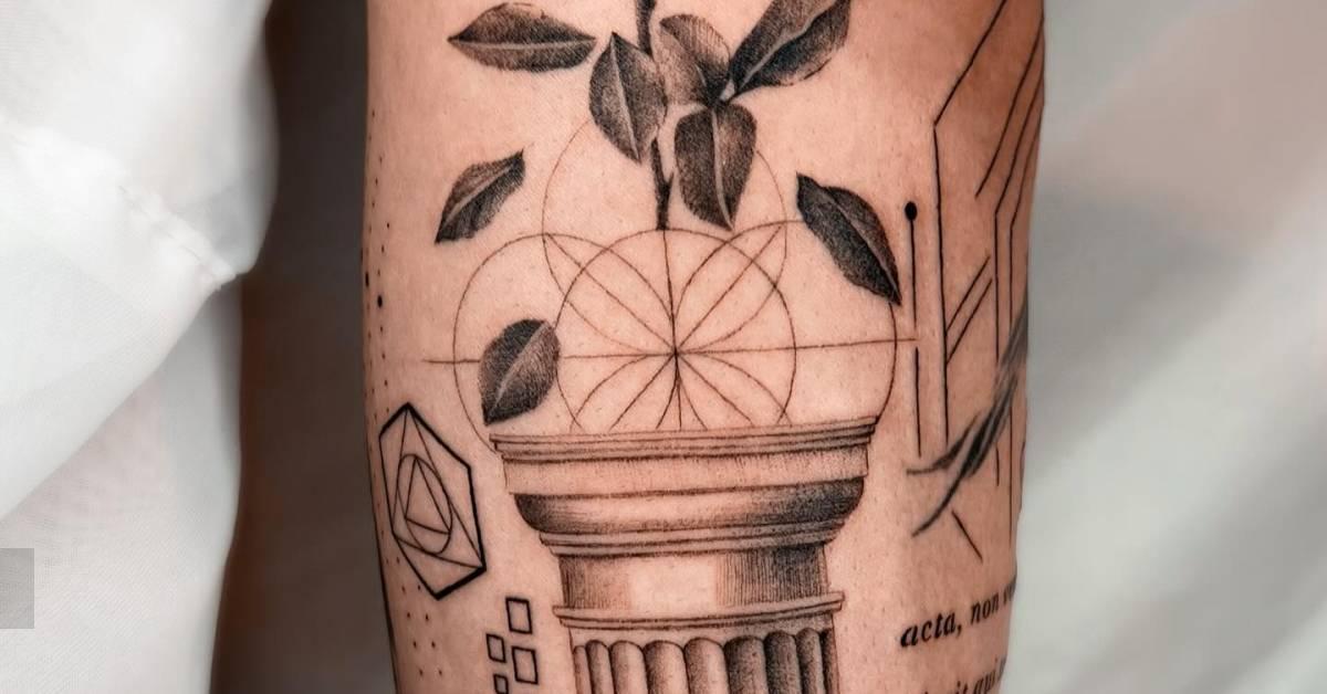 Column and rose tattoo located on the forearm, graphic