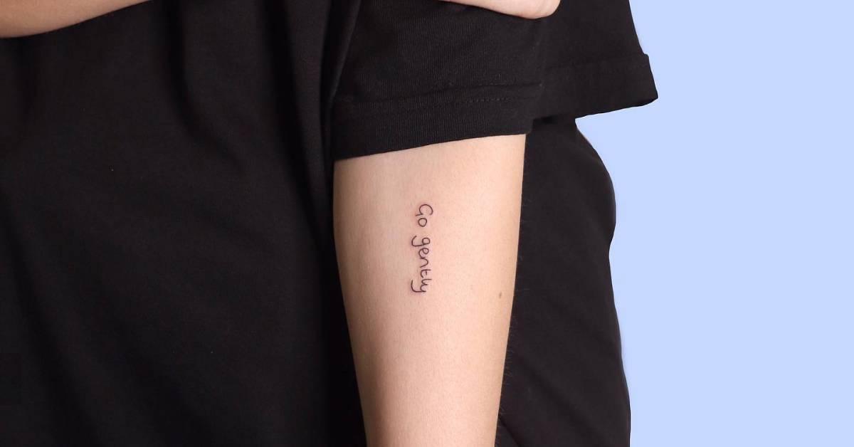 "Go gently" lettering tattoo placed on Anne-Marie's