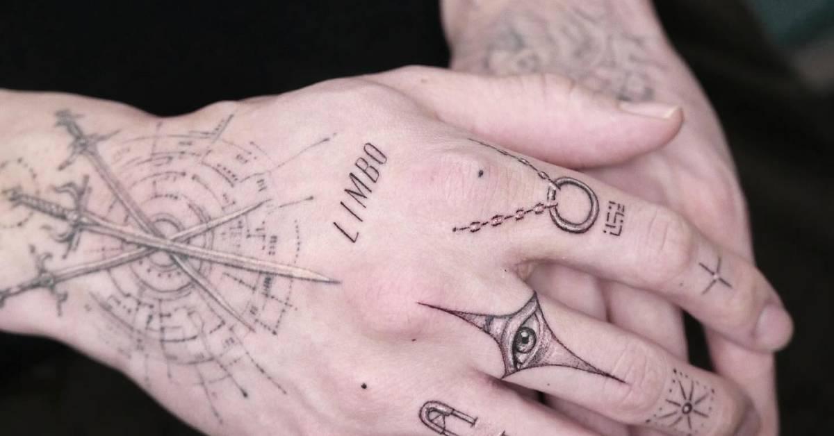 Keshi's finge composition tattoos.