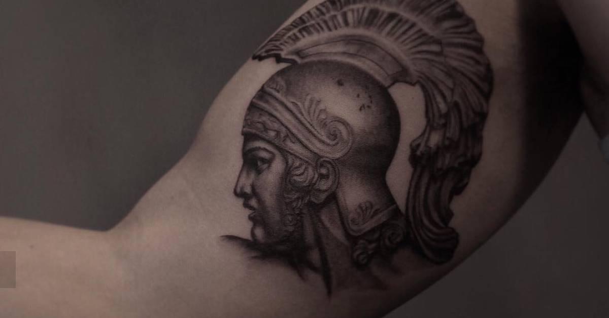 Ares tattoo located on the inner arm, black and grey
