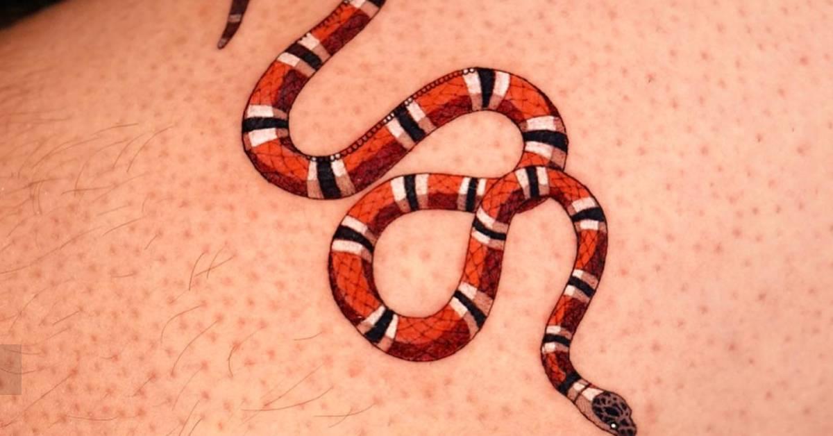 Micro-realistic style Gucci snake tattoo located on the
