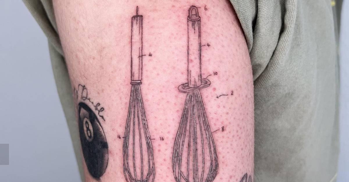 Illustrative style whisk tattoo located on the upper