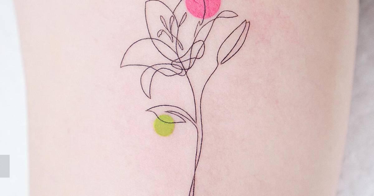 Lily flower tattoo located on the inner arm, fine line