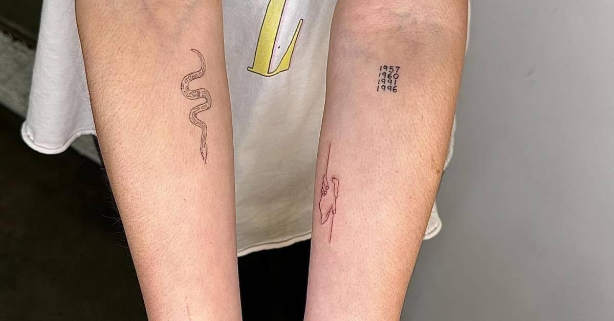 Fine line style arm composition tattoos.