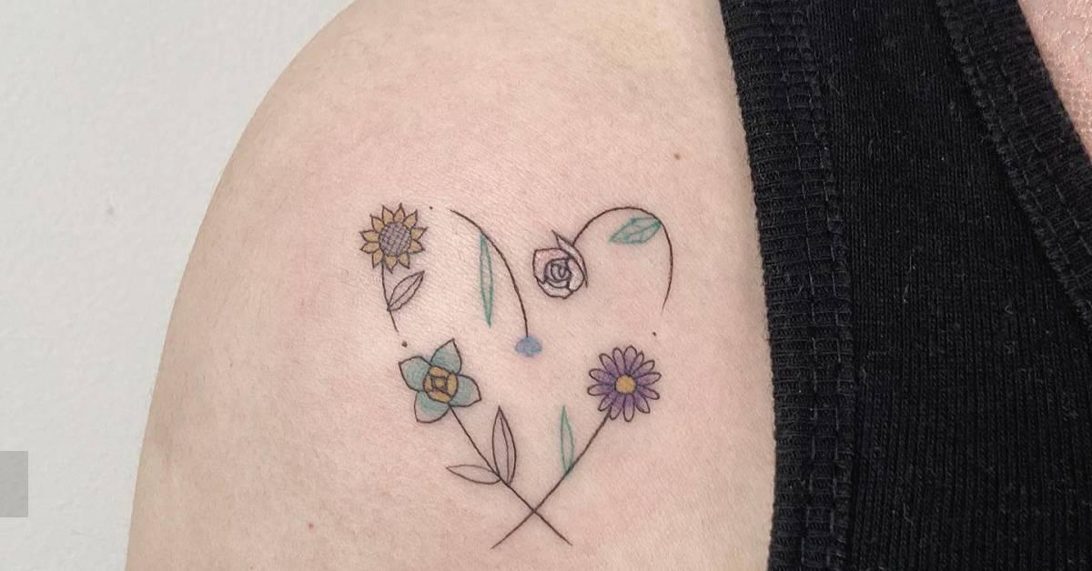Flower heart tattoo located on the shoulder.