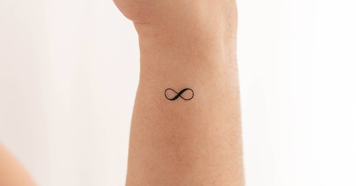 Little infinity symbol temporary tattoo located on the