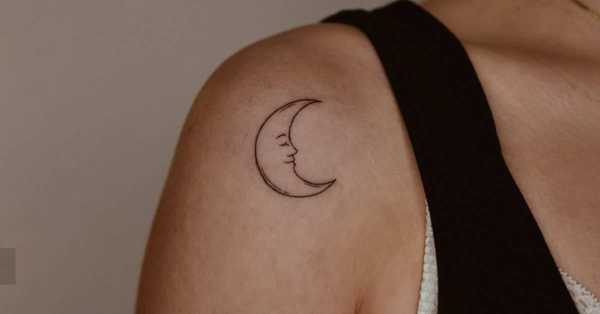Moon face tattoo located on the shoulder, fine line