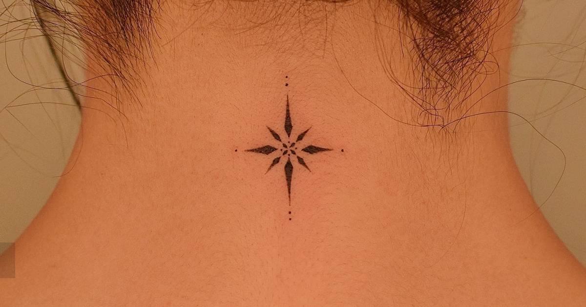Ornamental north star tattooed on the back of the neck.
