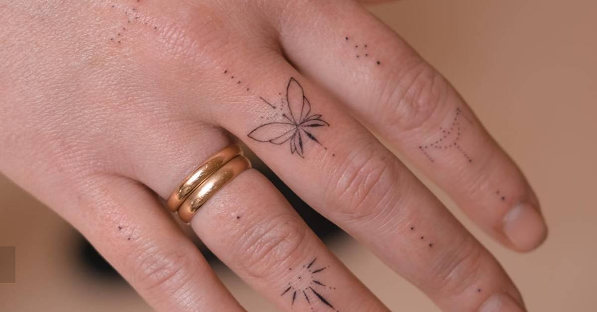 Finger composition tattoos hand poked style.