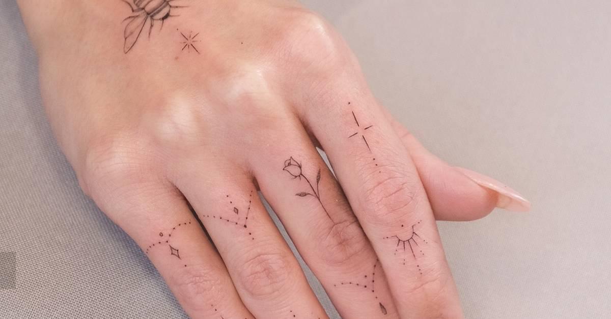 Fine line style hand composition tattoos.