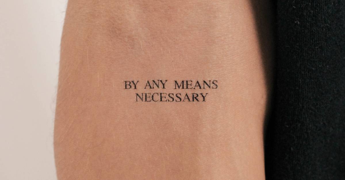 "By any means necessary" temporary lettering tattoo