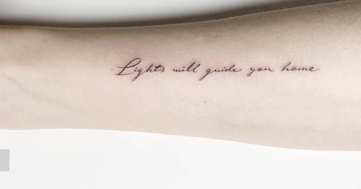 "Lights will guide you home" lettering tattoo located