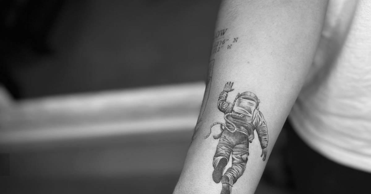 Micro-realistic style astronaut tattoo located on Wes