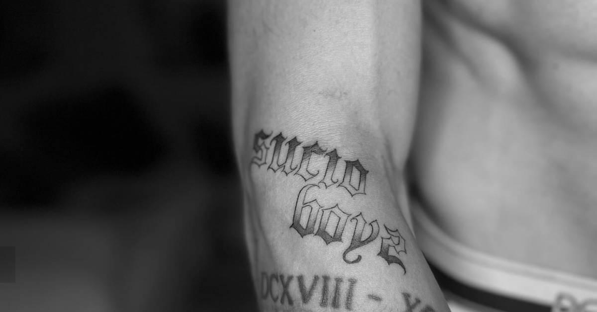 "Sucio boyz" lettering tattoo located on Liam Payne's