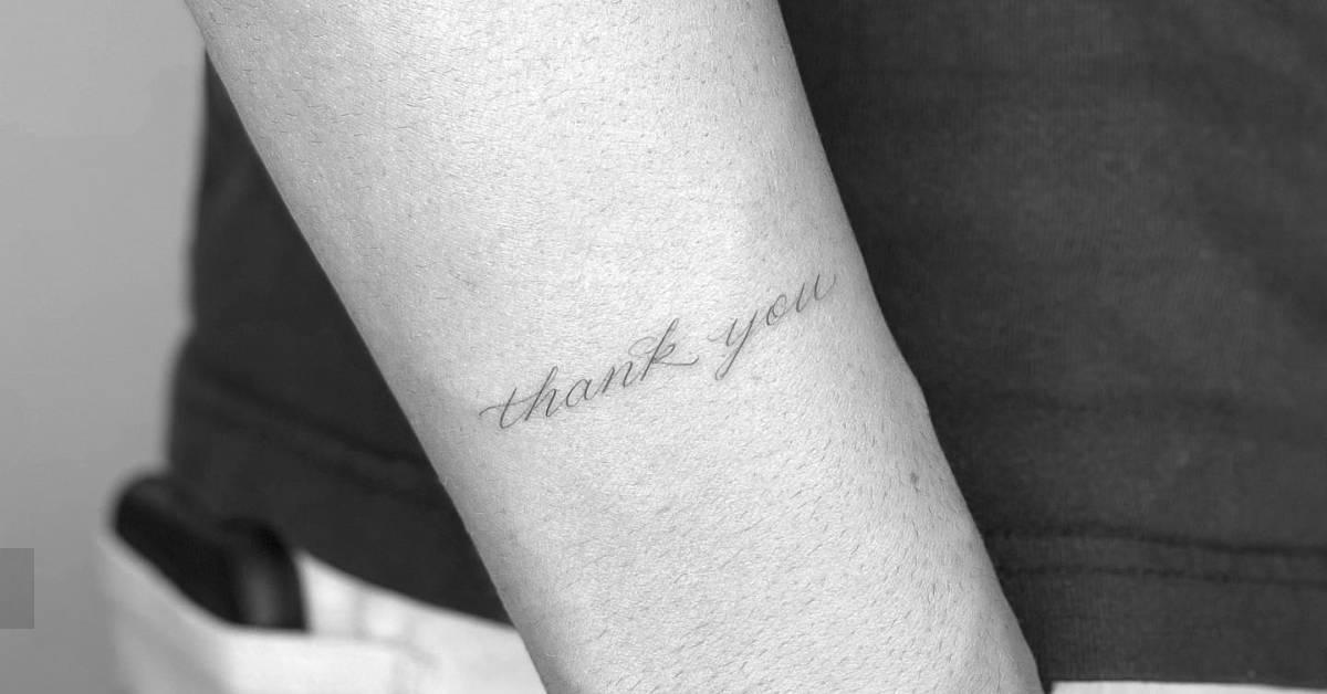 Tattoo that says "thank you" located on the wrist.
