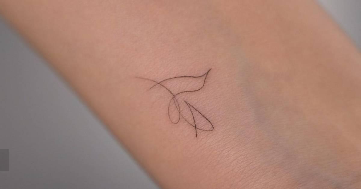 One line minimalistic hummingbird tattoo located on the