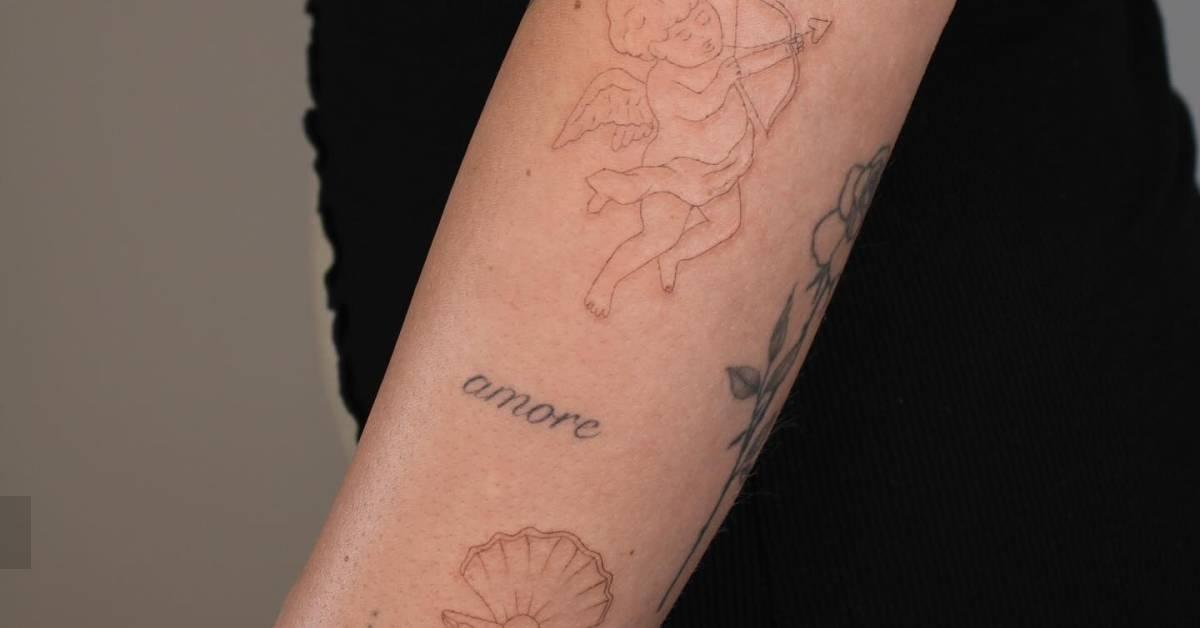 Fine line style forearm composition tattoos.