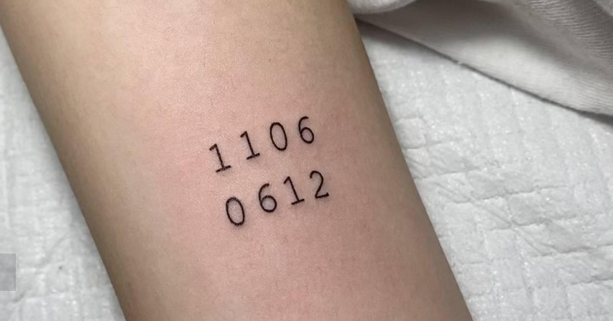 Numbers tattoo on the inner arm.